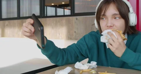 Youth addiction to junk food and the dig... | Stock Video | Pond5