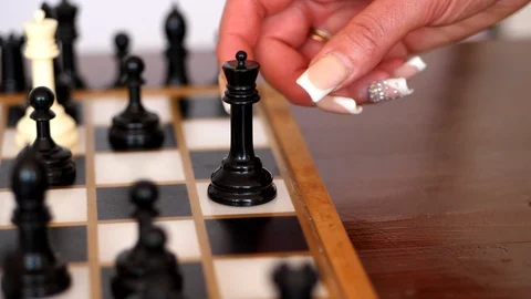 Yuriy Chess pieces. Chess board from har... | Stock Video | Pond5
