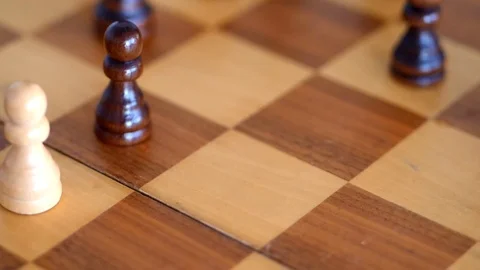 Yuriy Chess pieces. Chess board from har... | Stock Video | Pond5