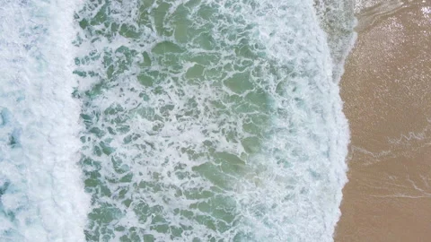 Zoom in aerial view of sand beach and wa... | Stock Video | Pond5