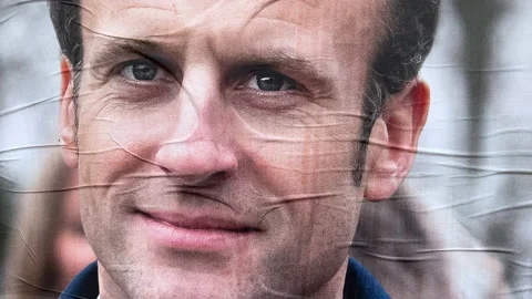 Zoom in to Emmanuel Macron face on placa... | Stock Video | Pond5