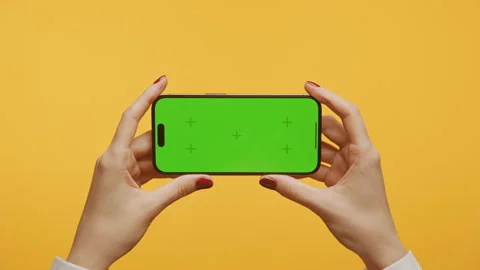 Zoom In Hands holding smartphone with gr... | Stock Video | Pond5
