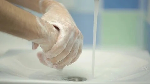 Zoom in of Man Washing Hands in slow mot... | Stock Video | Pond5