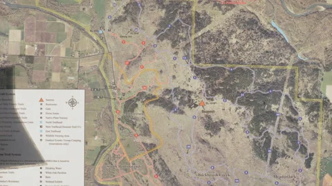 Zoom in of map with pathway trails acros... | Stock Video | Pond5