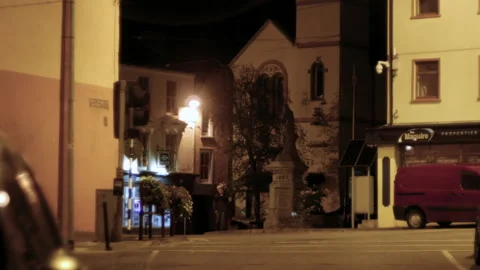 Zoom on a nighttime Irish square with cl... | Stock Video | Pond5