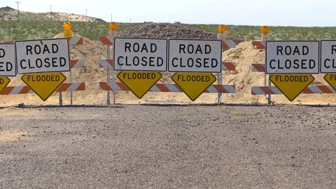 Zoom Out of Flooded Road Closed Signs | Stock Video | Pond5