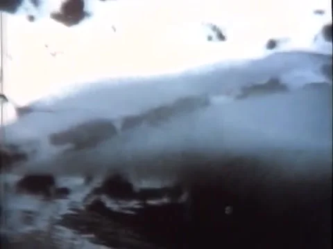 Zoom out to house covered in snow, 1970s | Stock Video | Pond5