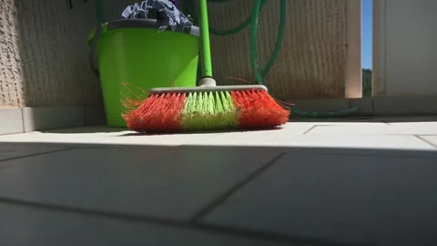 Zoom out video reveals a a broom, a buck... | Stock Video | Pond5