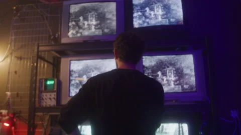 Zoom in Rear view of Man Watching Screen... | Stock Video | Pond5