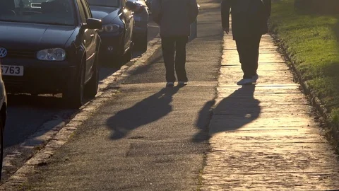 Zoom shot following the feet and shadows... | Stock Video | Pond5