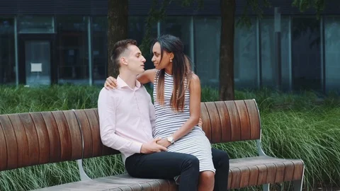 Zoom shot of handsome boy kissing his gi... | Stock Video | Pond5