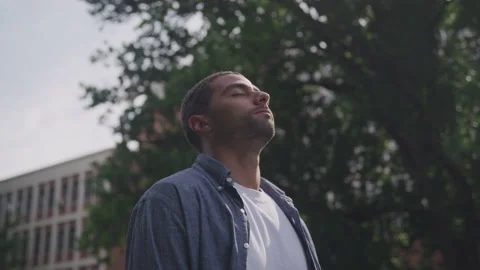 Zoom in Shot of Man with Eyes Closed Sta... | Stock Video | Pond5
