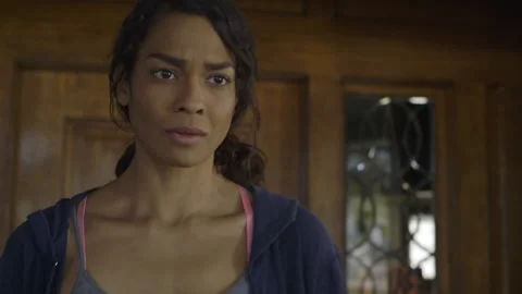 Zoom-in shot of scared young woman stand... | Stock Video | Pond5