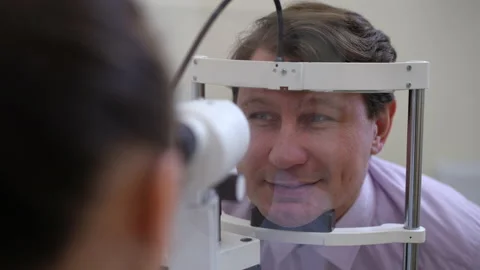 Zoom in to smiling Caucasian man sitting... | Stock Video | Pond5