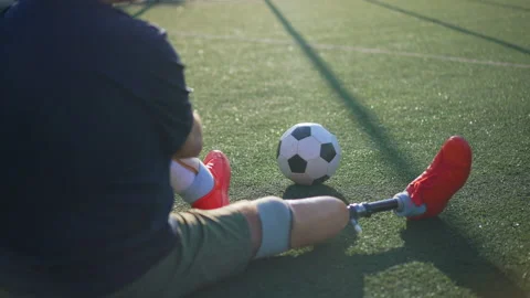 Zoom in to soccer ball on green grass wi... | Stock Video | Pond5