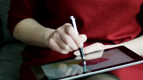 Zoom in to woman drawing on tablet compu... | Stock Video | Pond5