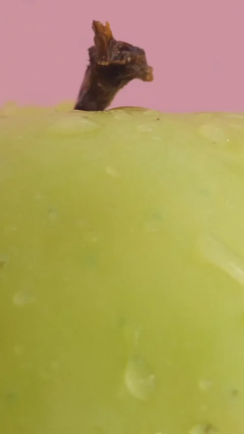 A zoomed-in image of a spinning green ap... | Stock Video | Pond5