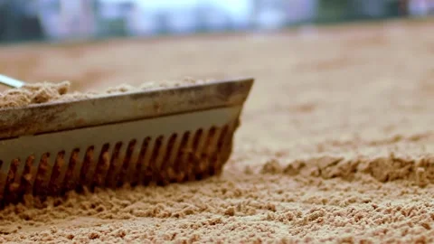 Zoomed-In Slow Motion of Raking Sand on ... | Stock Video | Pond5