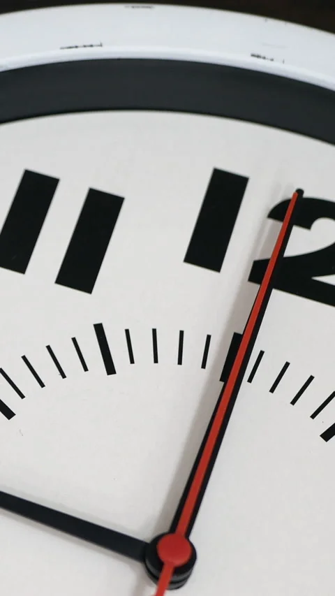 Zoomed-In View Of A Clock Face Displayin... | Stock Video | Pond5