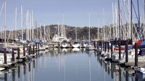 zooming out from docked boats in water i... | Stock Video | Pond5