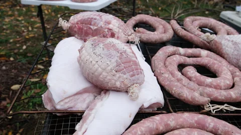 Zooming out of pork meat in ham sack rea... | Stock Video | Pond5